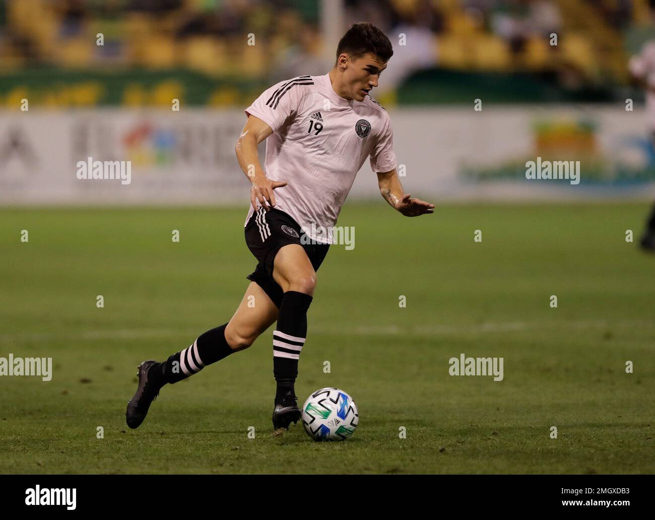 inter Miami FC's Robbie Robinson carries the ball against the Tampa Bay ...