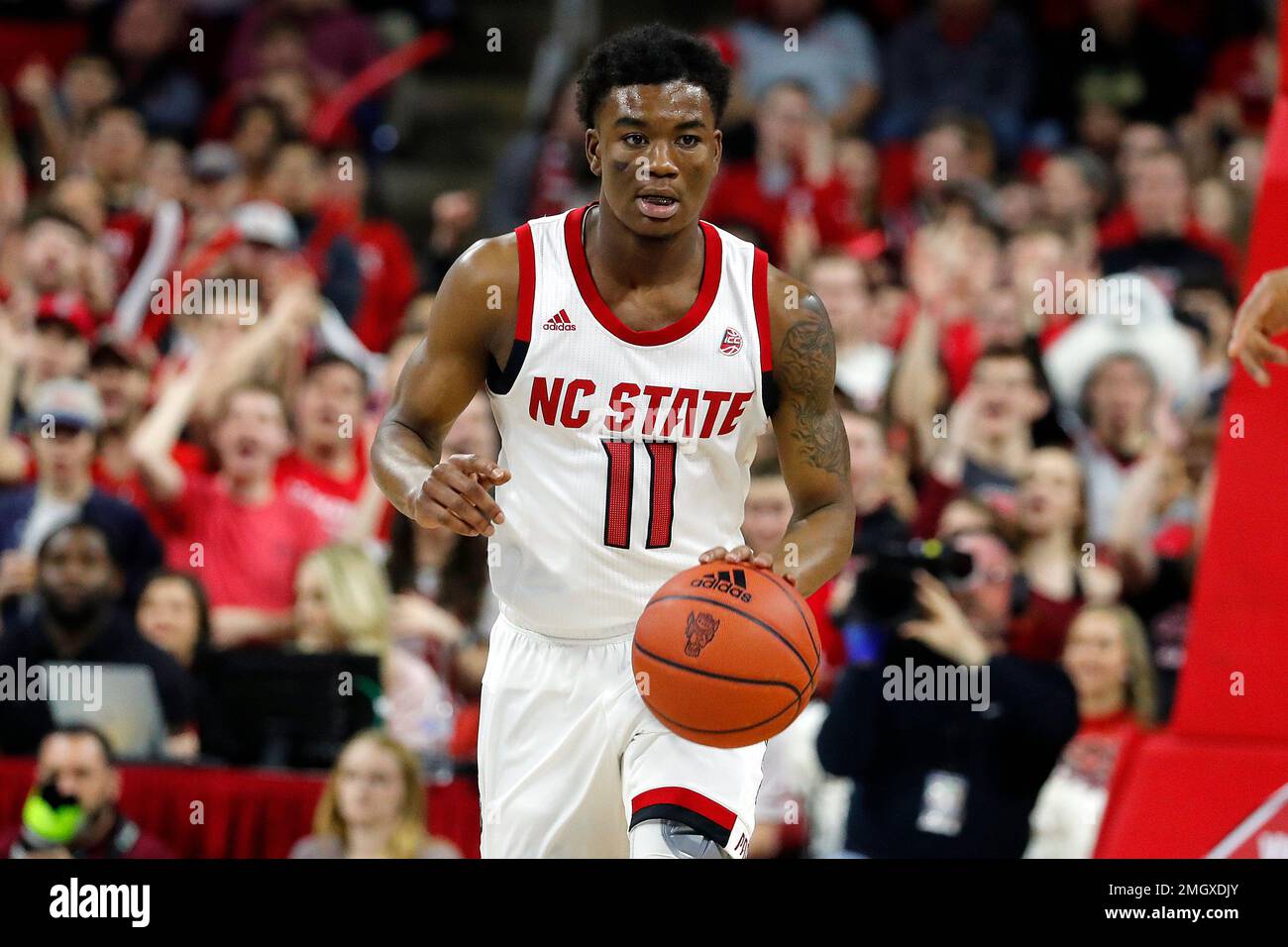 North Carolina State's Markell Johnson (11) brings the ball up the ...