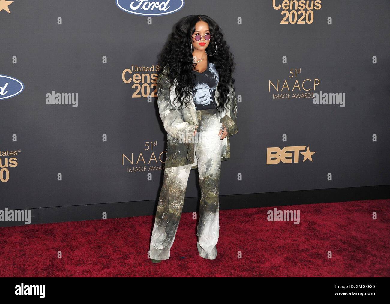 H.E.R arrives at the 51st NAACP Image Awards at the Pasadena Civic Auditorium on Saturday, Feb ...