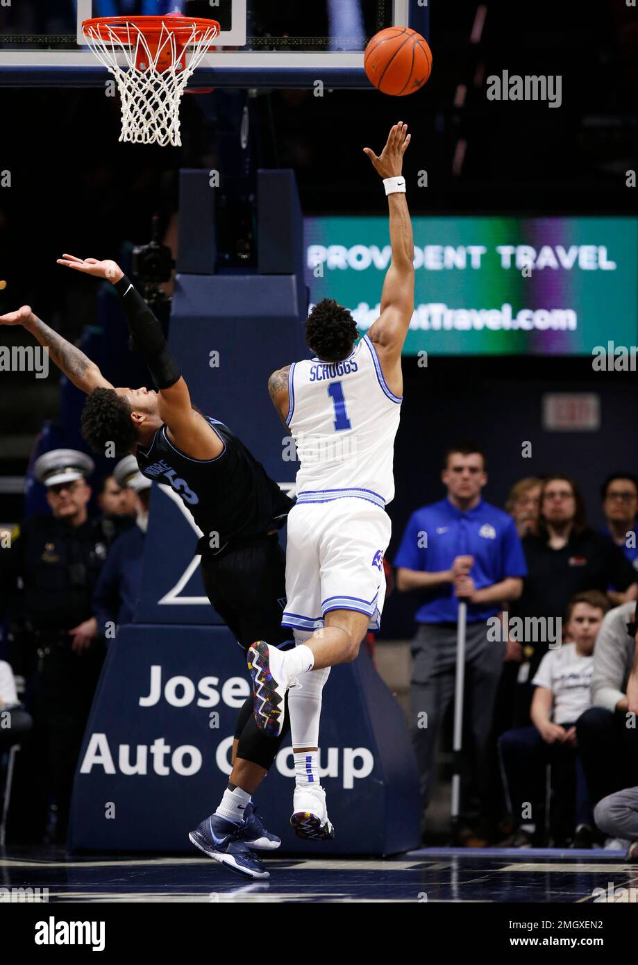 Xavier guard Paul Scruggs (1) shoots around Villanova guard Justin ...
