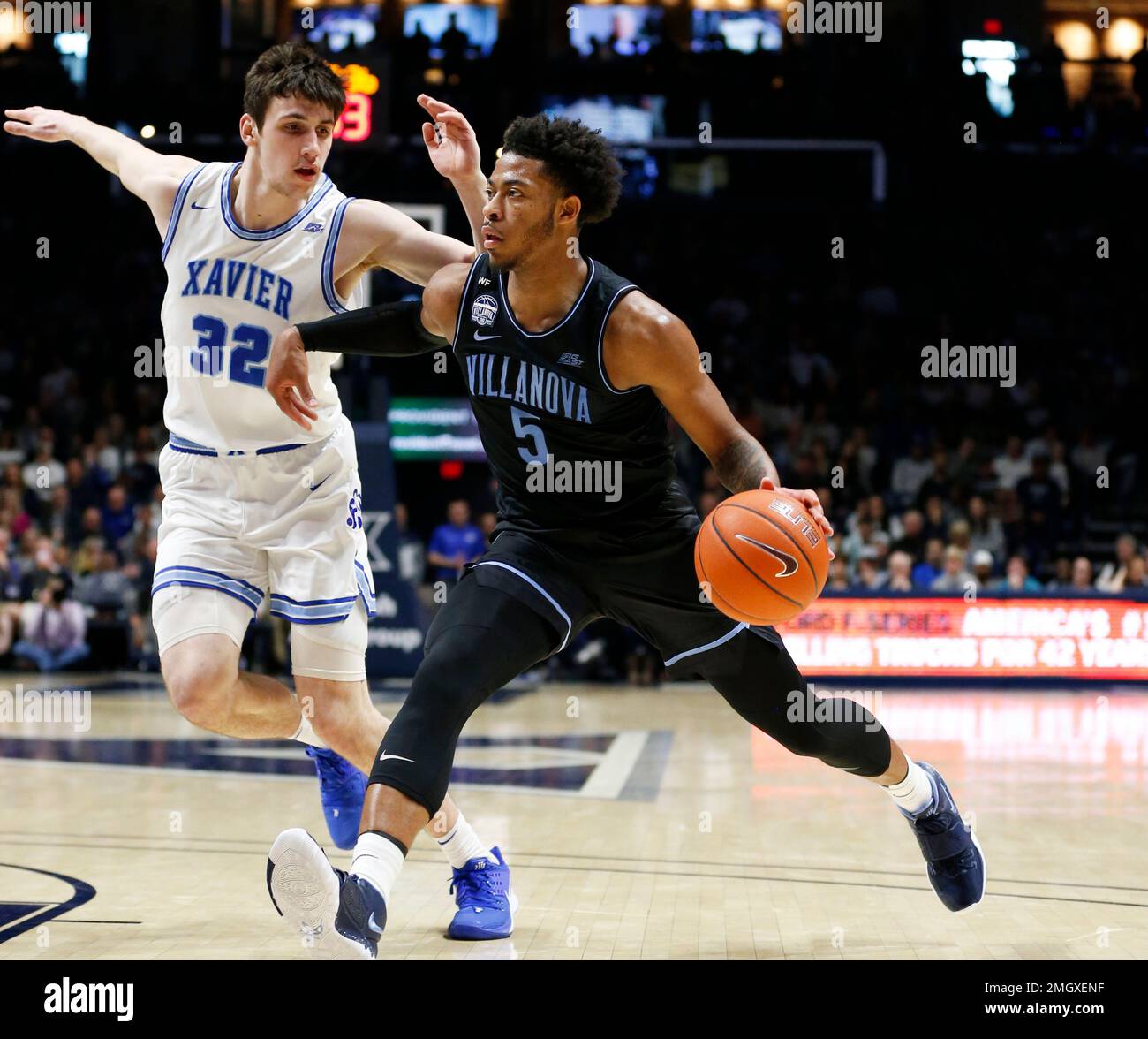 Villanova guard Justin Moore (5) drives against Xavier forward Zach ...