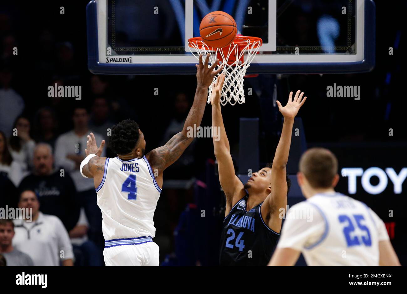 Xavier forward Tyrique Jones (4) shoots over Villanova forward Jeremiah ...