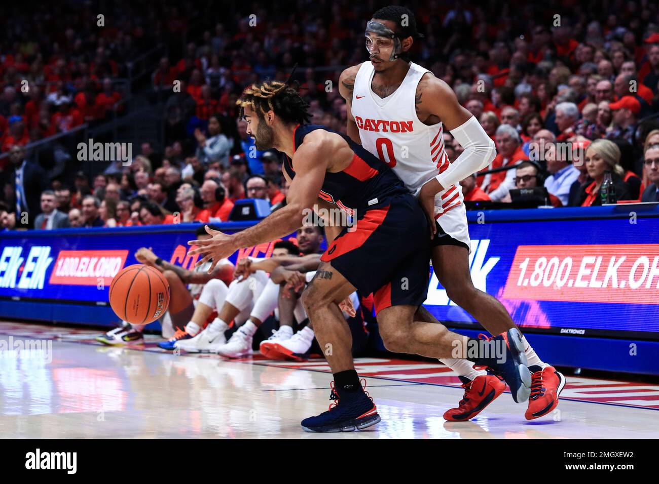 Duquesne's Sincere Carry (10) controls the ball against Dayton's Rodney ...