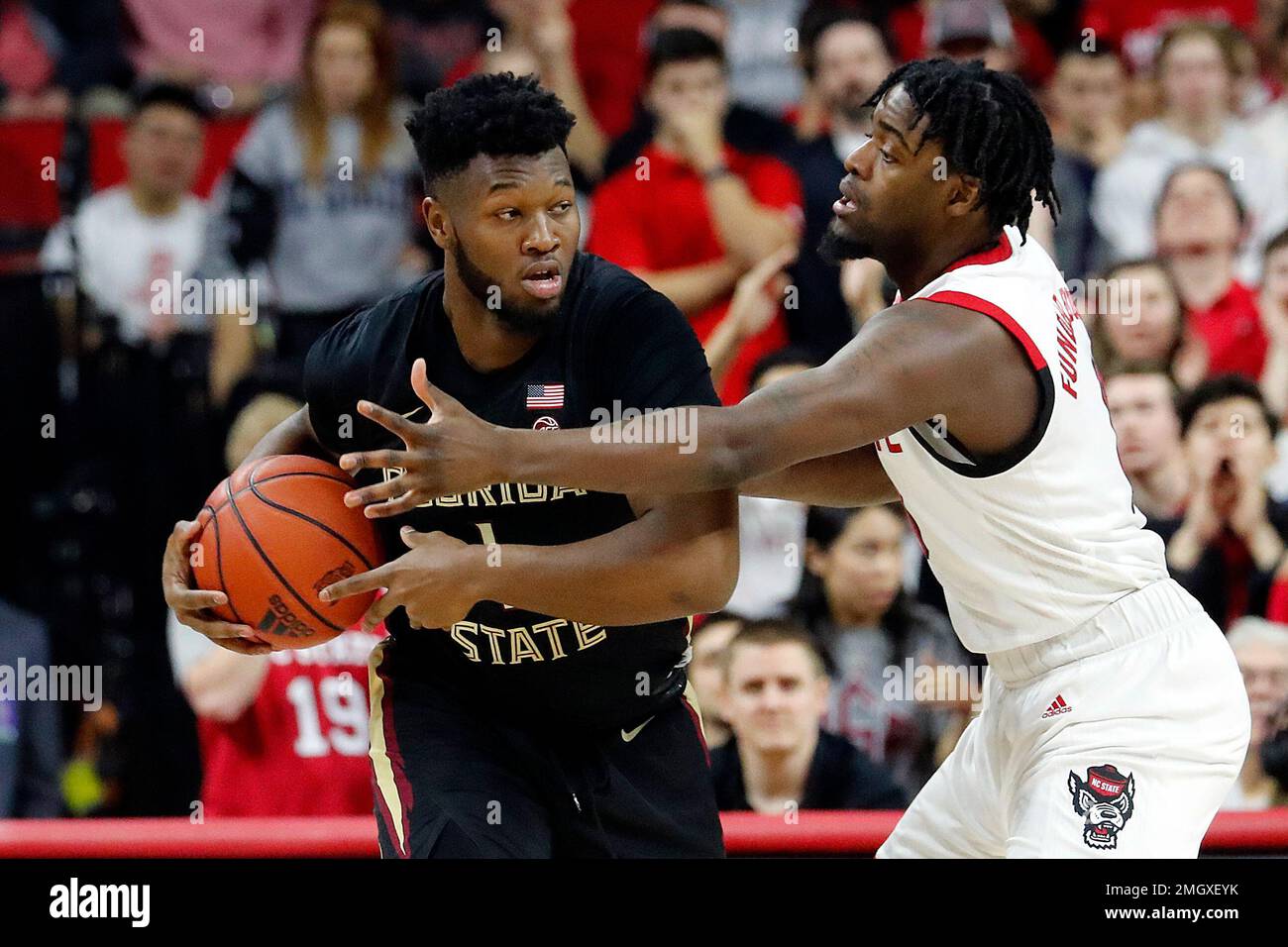 North Carolina State's DJ Funderburk, right, battles with Florida State ...