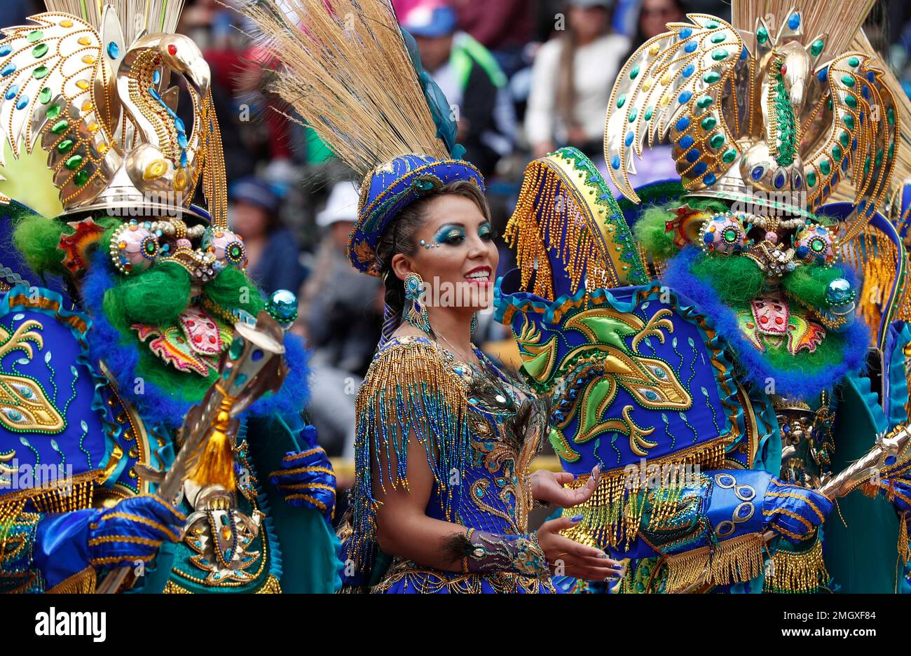 Dancers perform in the traditional "Morenada" dance during Carnival in ...