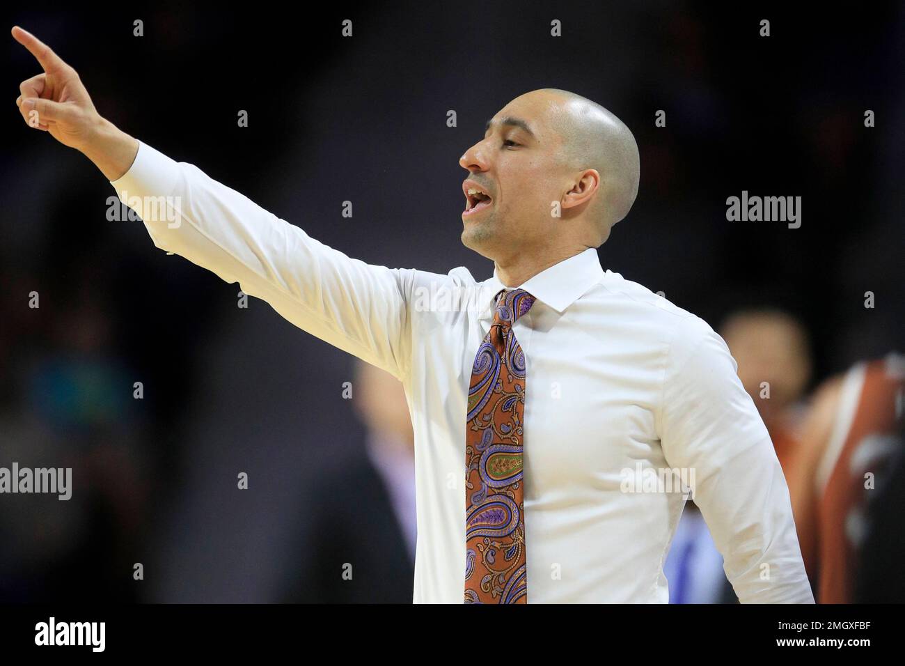 Texas head coach Shaka Smart directs his team during the first half of ...