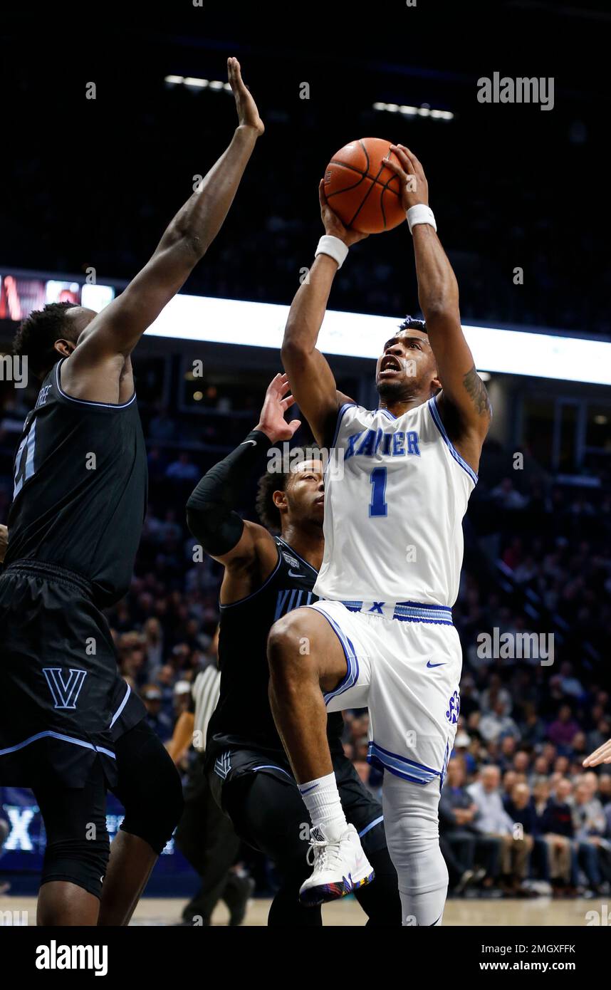 Xavier guard Paul Scruggs (1) shoots over Villanova forward Dhamir ...