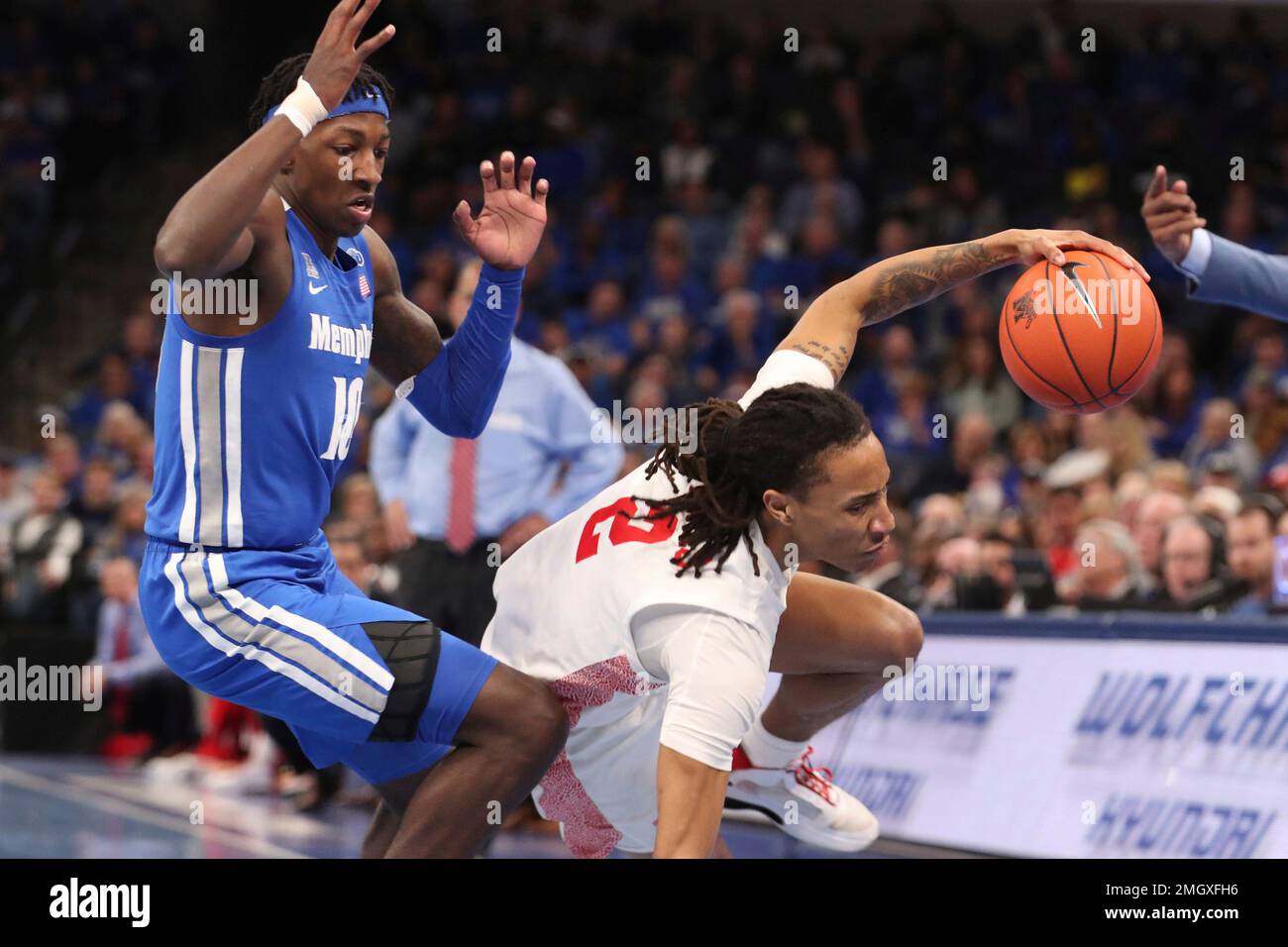 Houstons guard Caleb Mills (2) gets tripped up on the court as Memphis ...