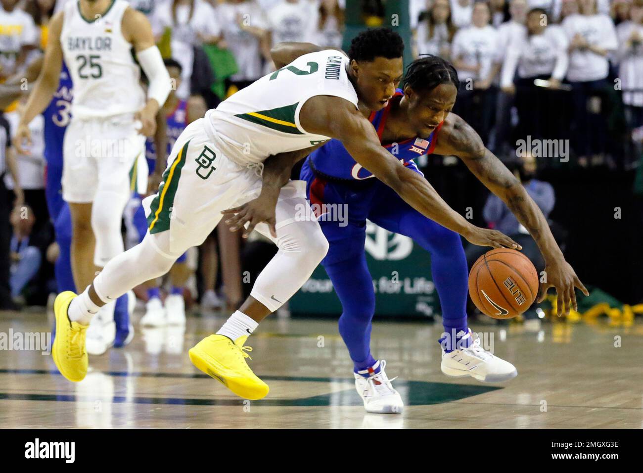 Baylor guard Devonte Bandoo, left, and Kansas guard Marcus Garrett ...