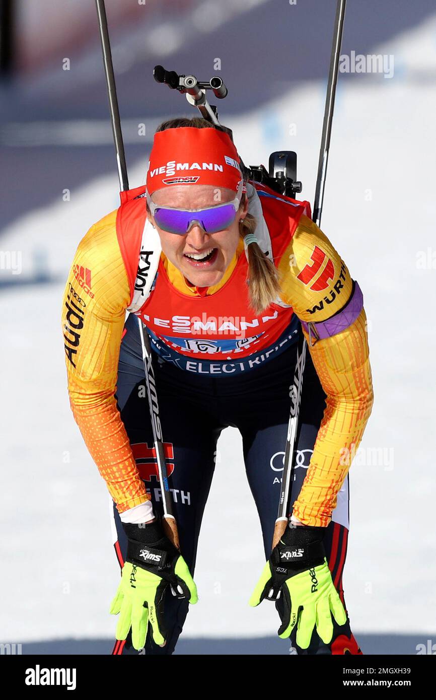 Denise Herrmann of Germany reacts as she crosses the finish line in ...
