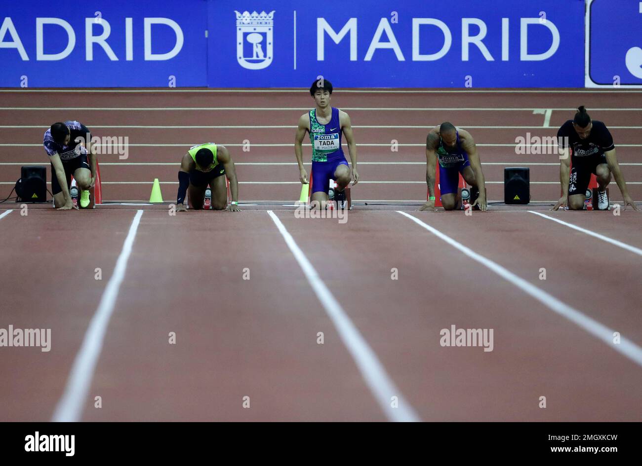 Shuhei Tada, of Japan, centre, competes in the men's 60 meters race ...