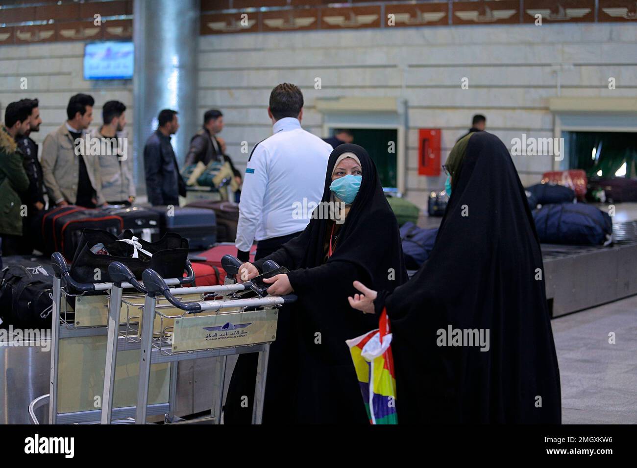 Women arriving from Iran wearing masks in Najaf, Iraq, Friday, Feb. 21 ...