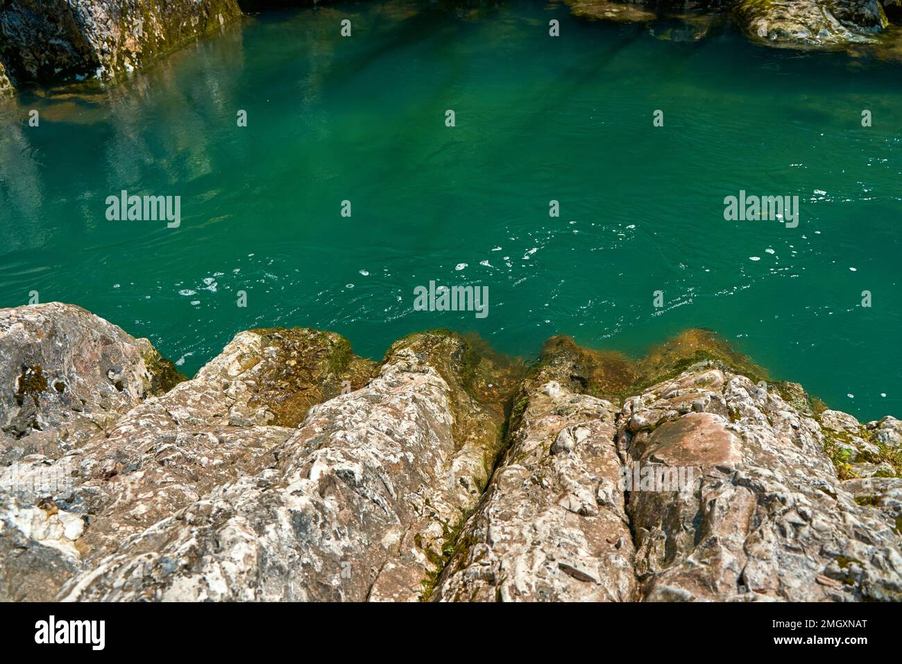The natural pool of the mountain river with emerald clear water Stock ...
