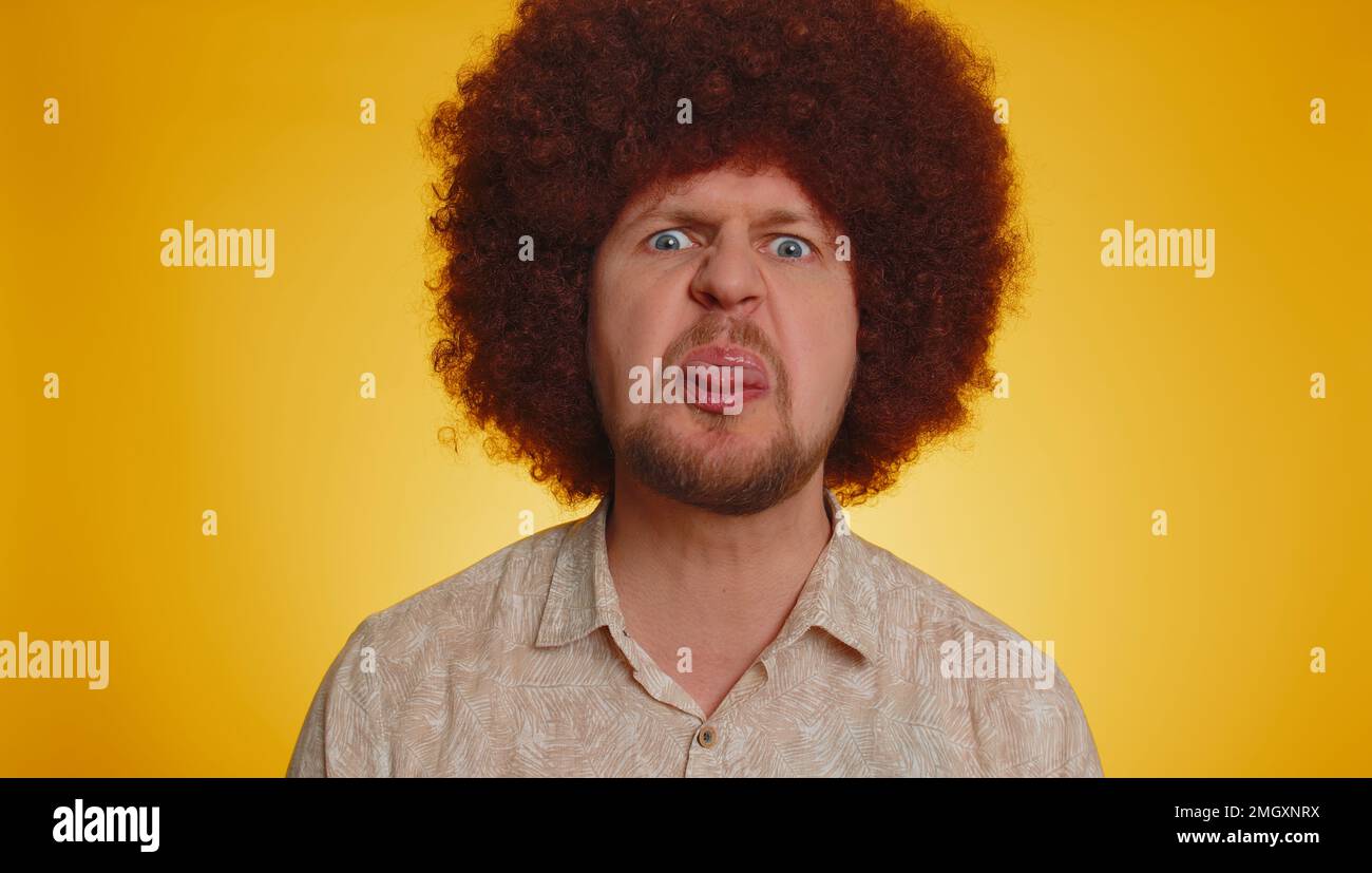 Funny joyful sincere man with lush Afro hairstyle coiffure making ...