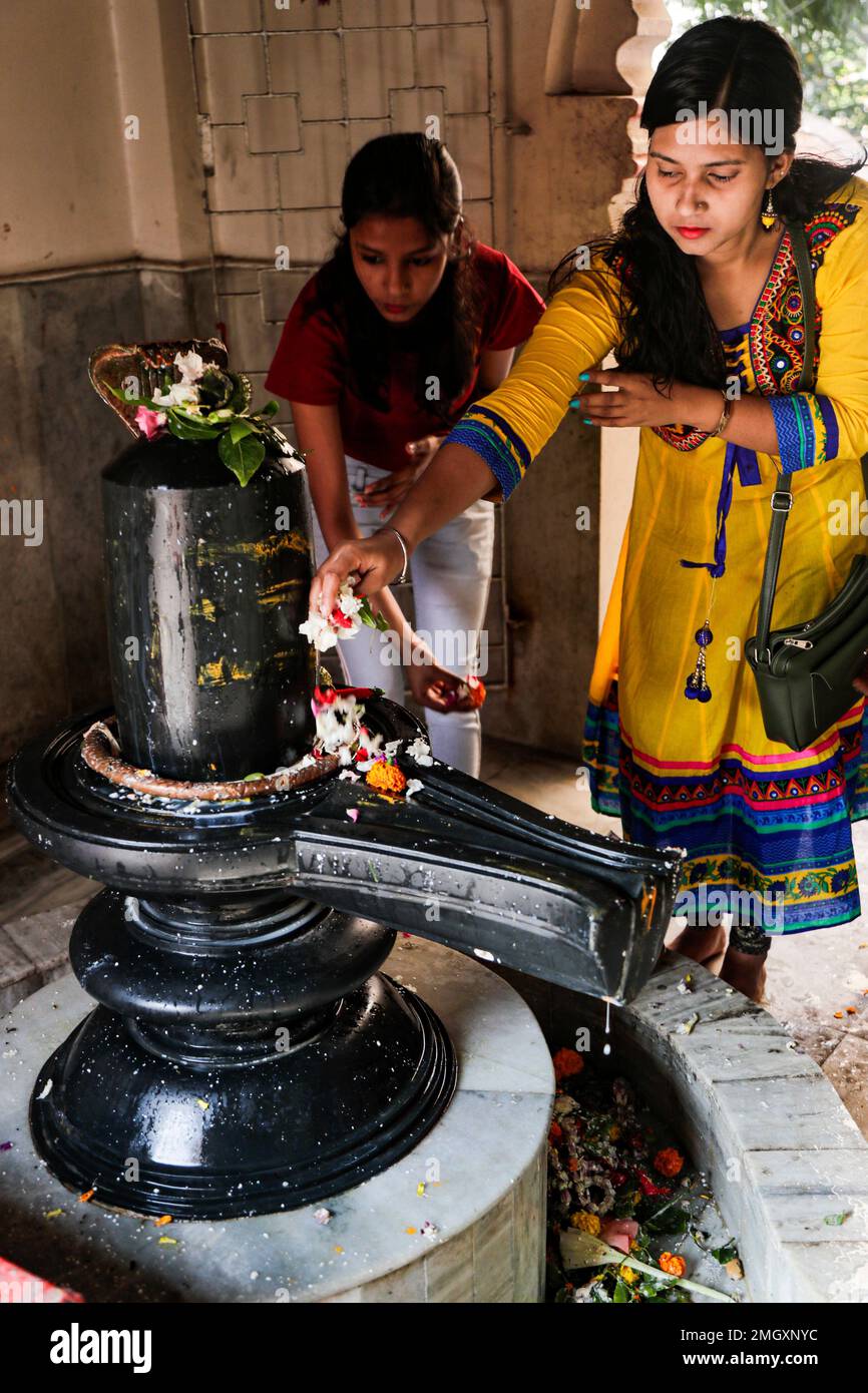 Hindu devotees worship a Shivling, a representation of Hindu god Shiva ...