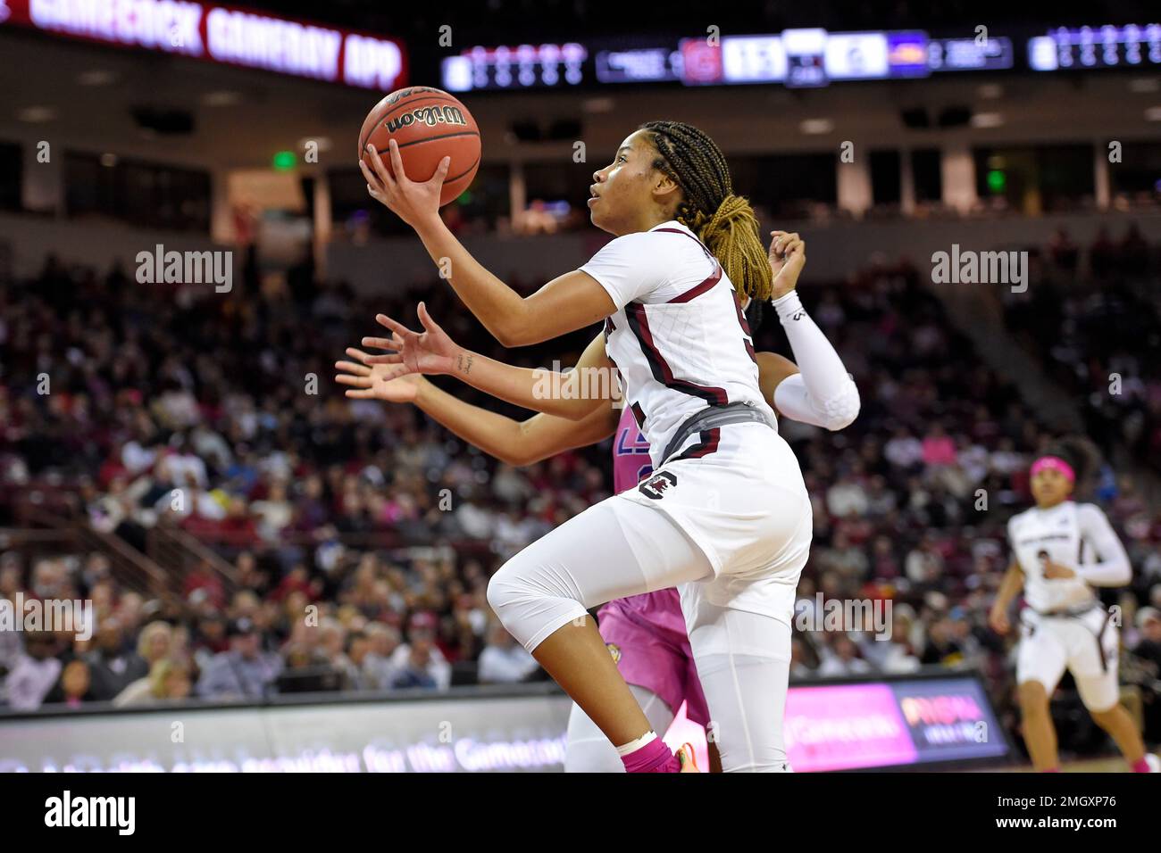 South Carolina's Tyasha Harris drives to the basket while defended by ...