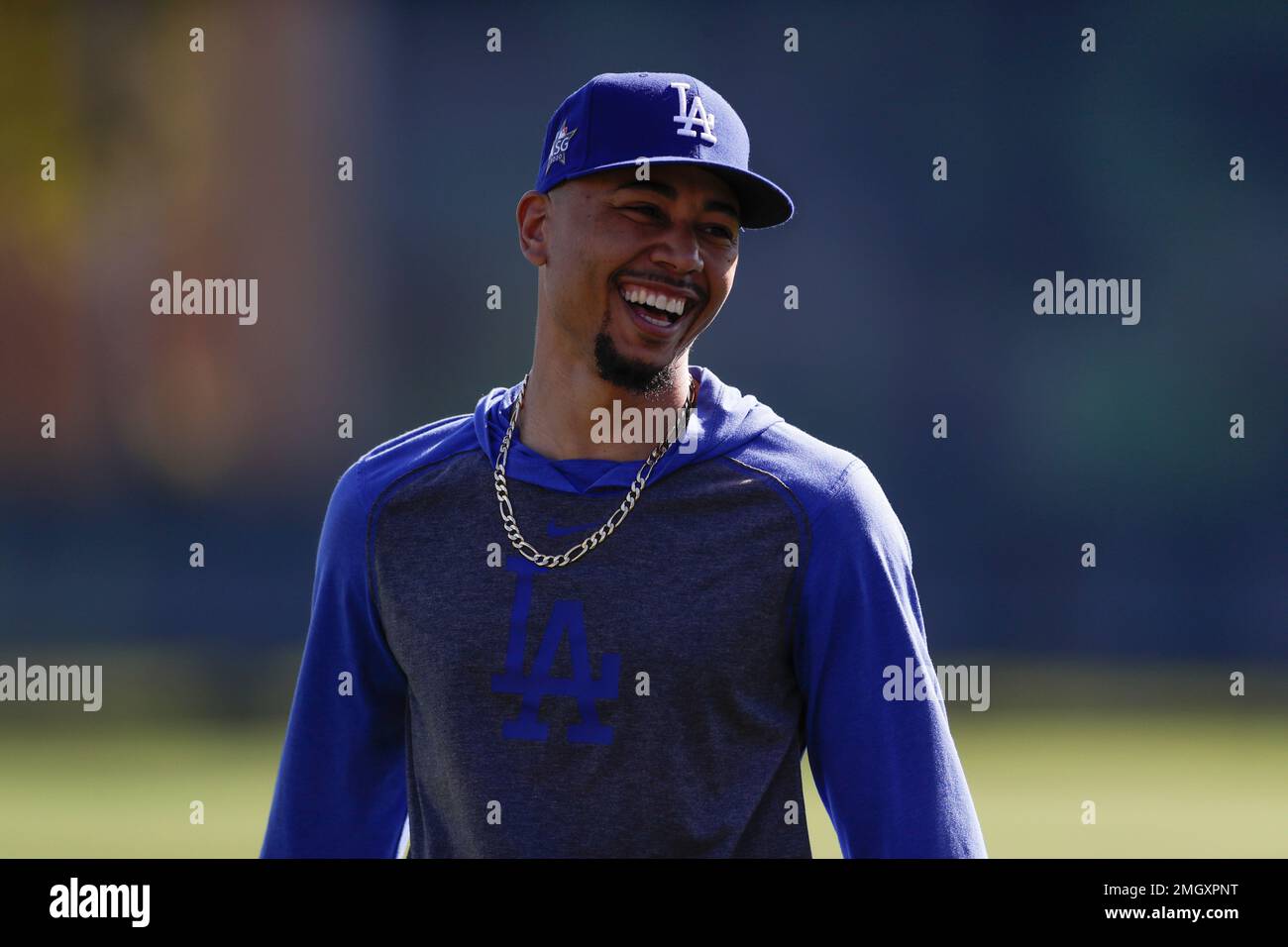 Los Angeles Dodgers right fielder Mookie Betts reacts during spring ...