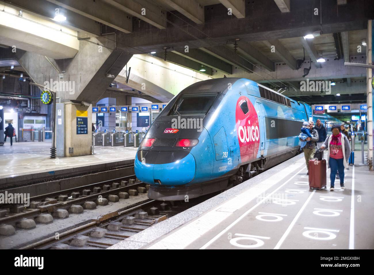 A OuiGo train stopped on the platform. On the platforms of the Gare ...