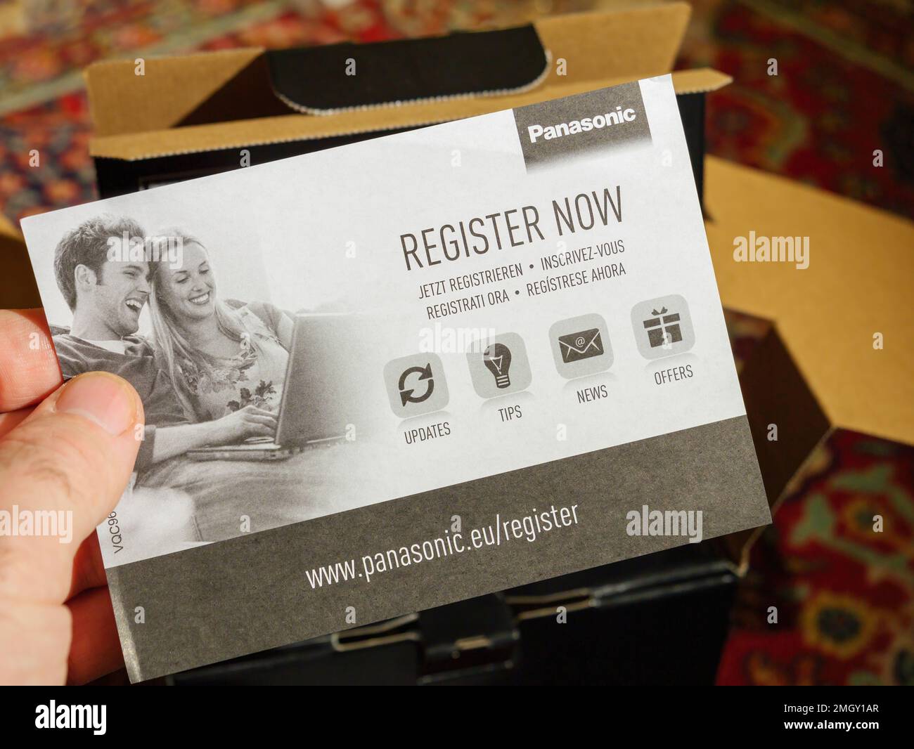 Paris, France - Dec 2, 2022: Male hand holding Register now flyer paper ...