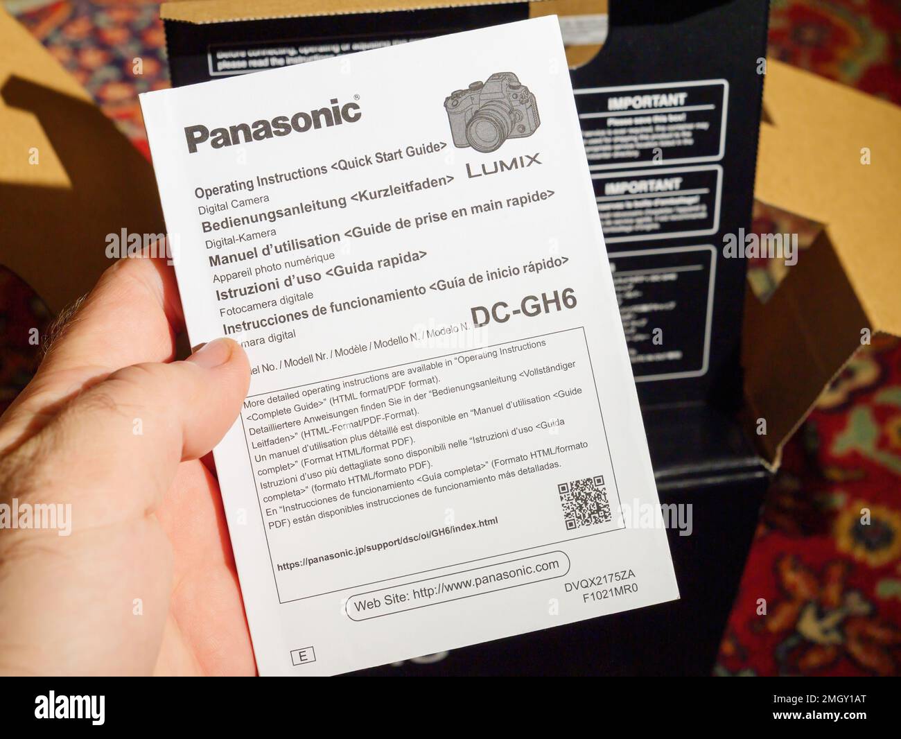 Paris, France - Dec 2, 2022: Male hand holding operating instruction ...