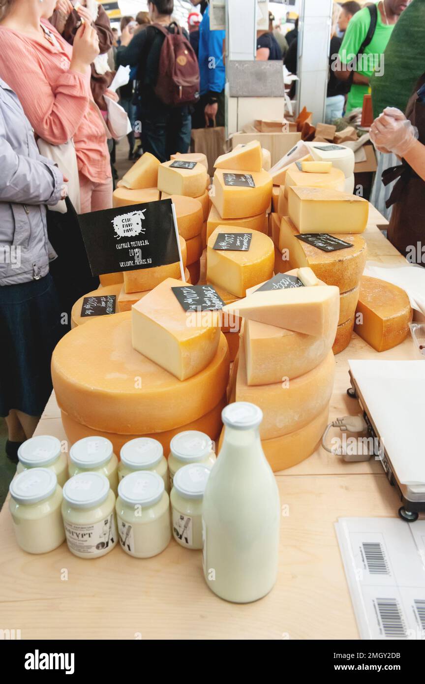Farm dairy products - cheeses, milk and yogurt are presented on the ...