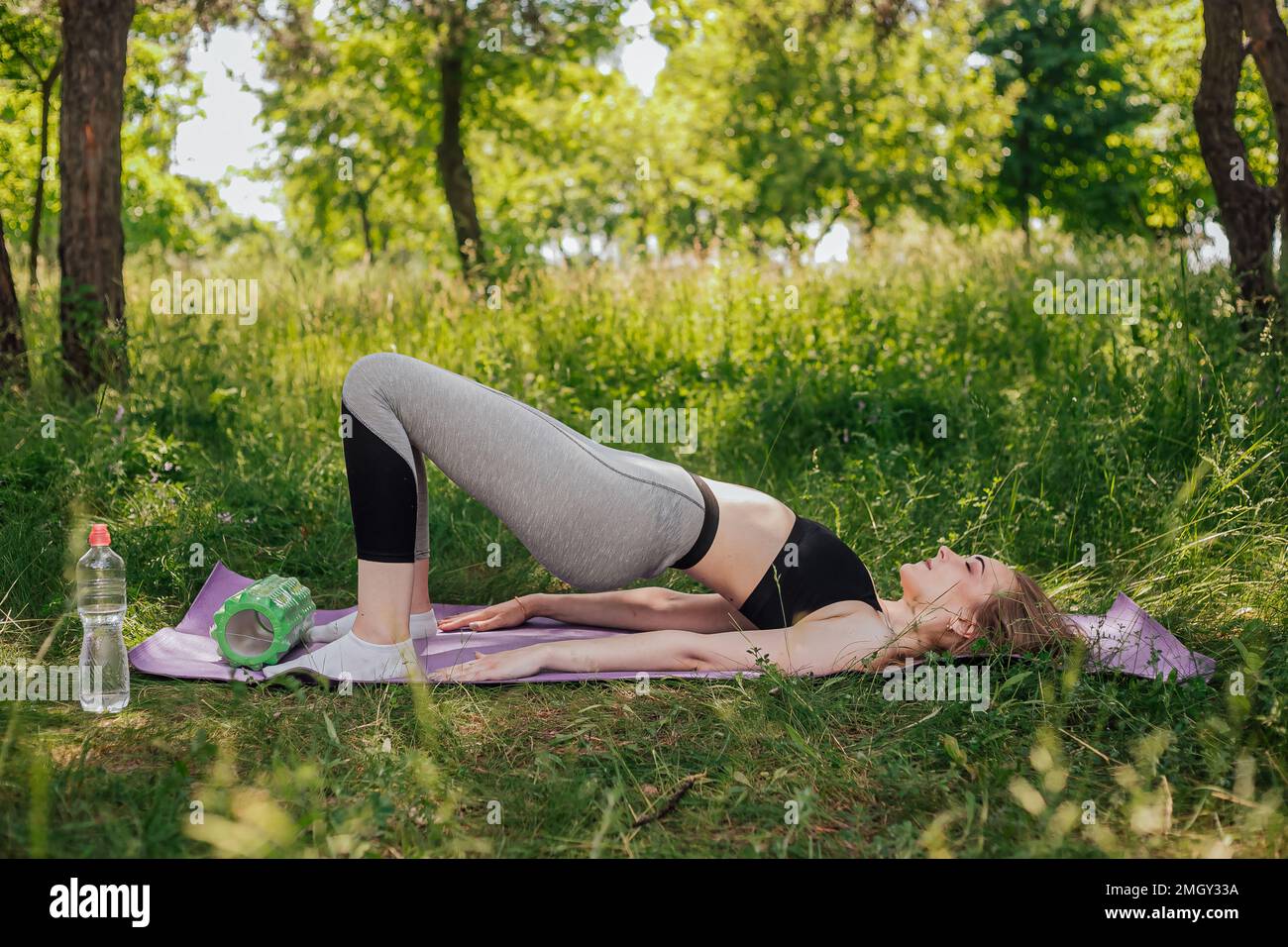Woman exercise workout in gym fitness breaking relax holding apple ...
