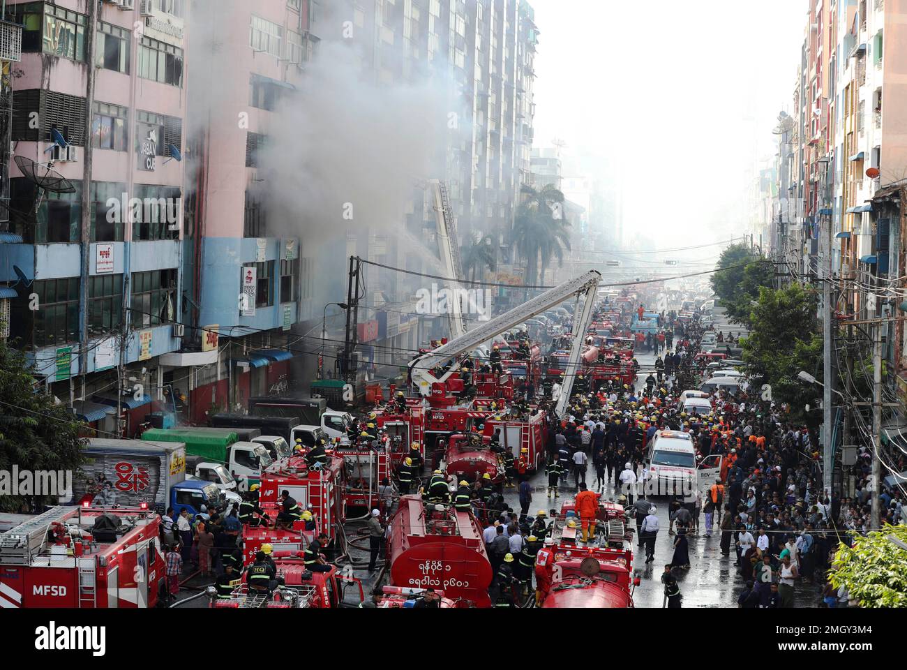 Firefighters attempt to put out fire at a market building during a fire ...