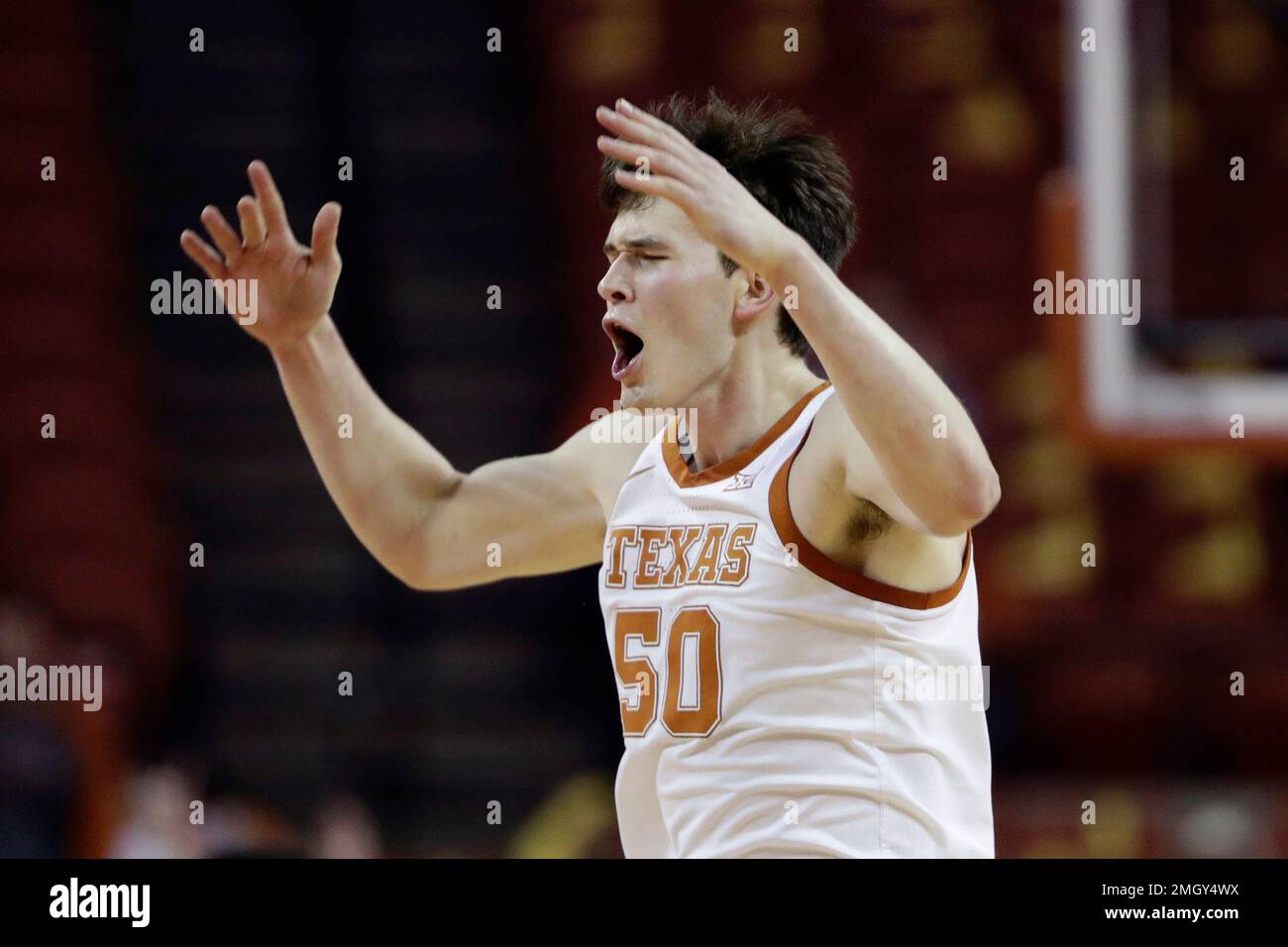 Texas center Will Baker (50) reacts after scoring against TCU during the first half of an NCAA ...