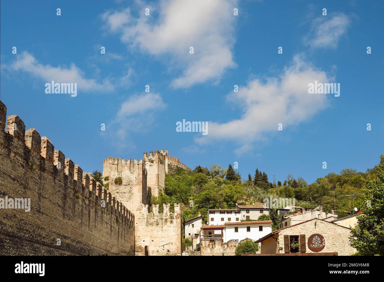 The fortified walls (1369) with crenellated towers of the medieval ...