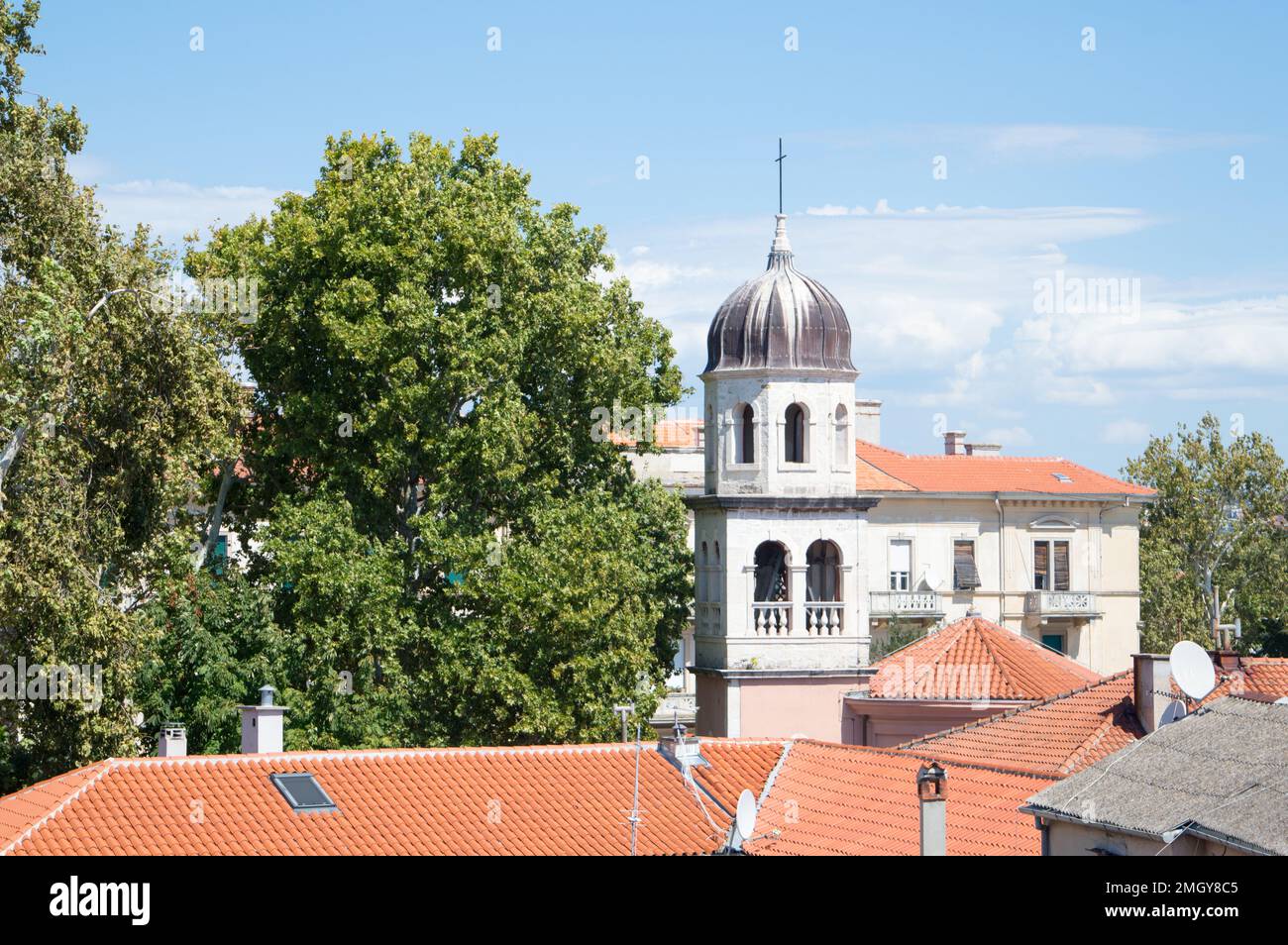 Beautiful bell tower from Church of Our Lady of Health surrounded with ...