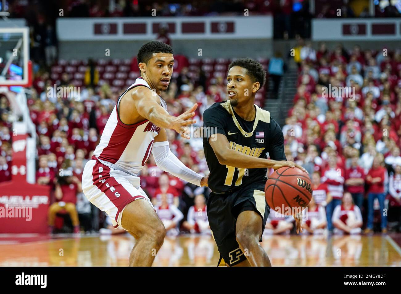 Purdue's Isaiah Thompson (11) and Wisconsin's D'Mitrik Trice (0) during ...