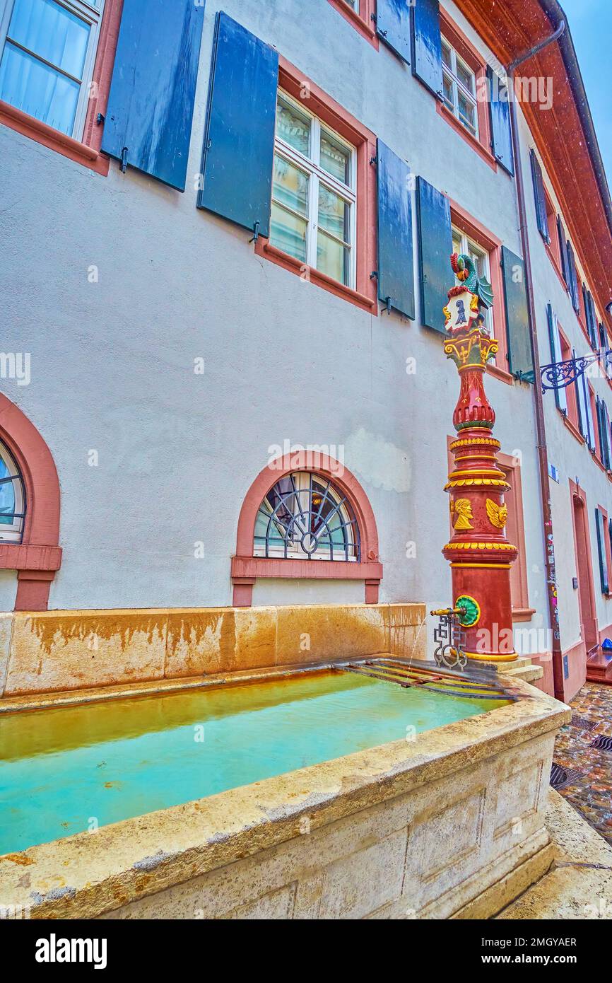 The small Augustiner Brunnen fountain with sculpture of the dragon ...