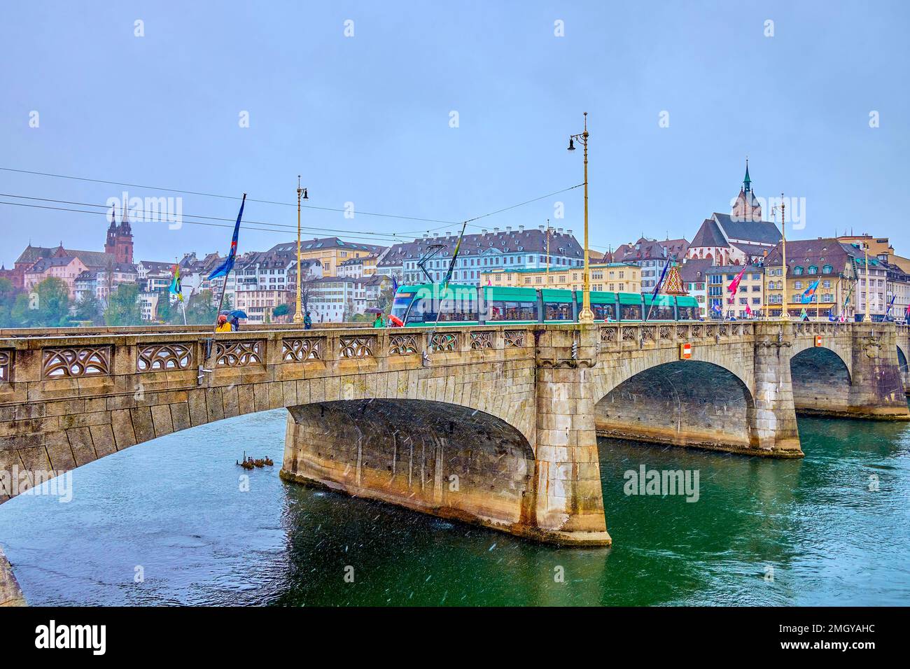 BASEL, SWITZERLAND - APRIL 1, 2022: The modern green tram ridel on ...