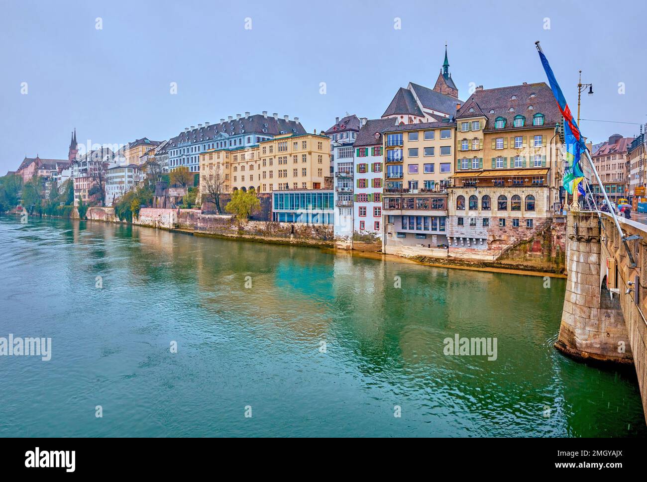 BASEL, SWITZERLAND - APRIL 1, 2022: Panorama of Rhine riverside houses ...