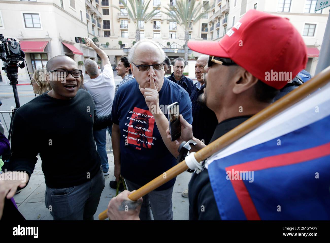 Protesters argue opposing views outside of a campaign fundraiser for ...