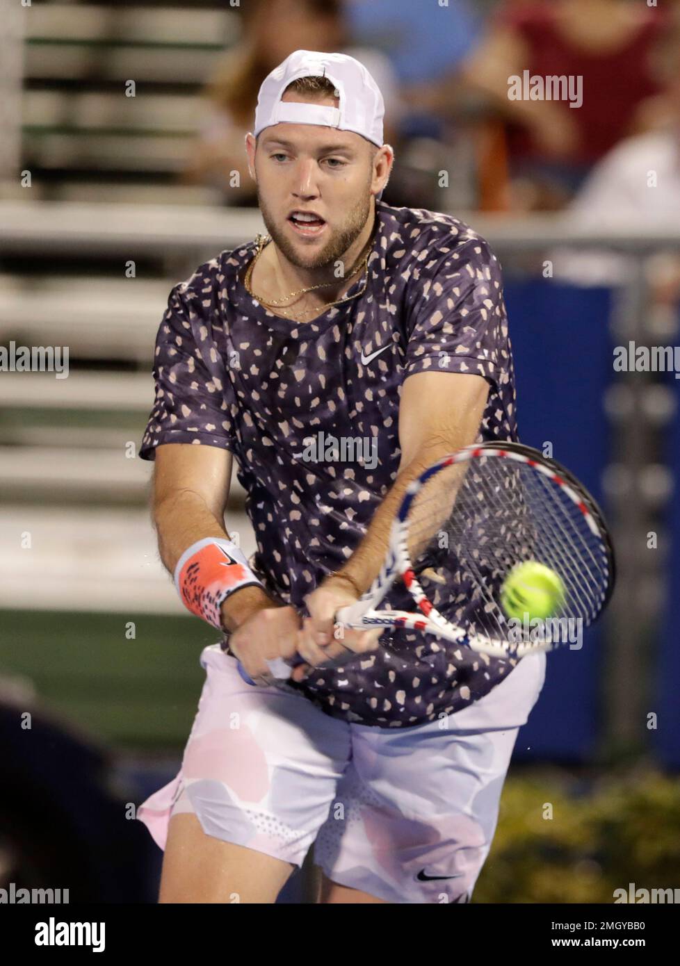 Jack Sock returns to Radu Albot, of Moldova, during the Delray Beach ...