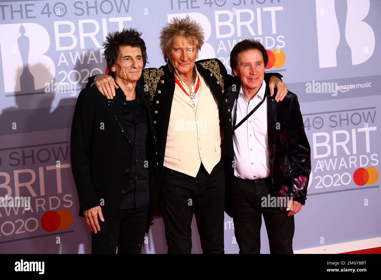 Ronnie Wood, Kenney Rogers and Rod Stewart pose for photographers upon ...