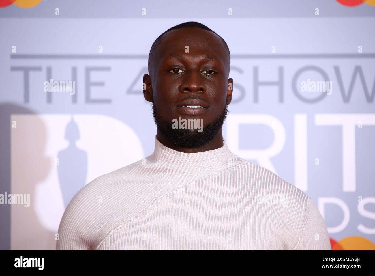 Stormzy poses for photographers upon arrival at the Brit Awards 2020 in ...