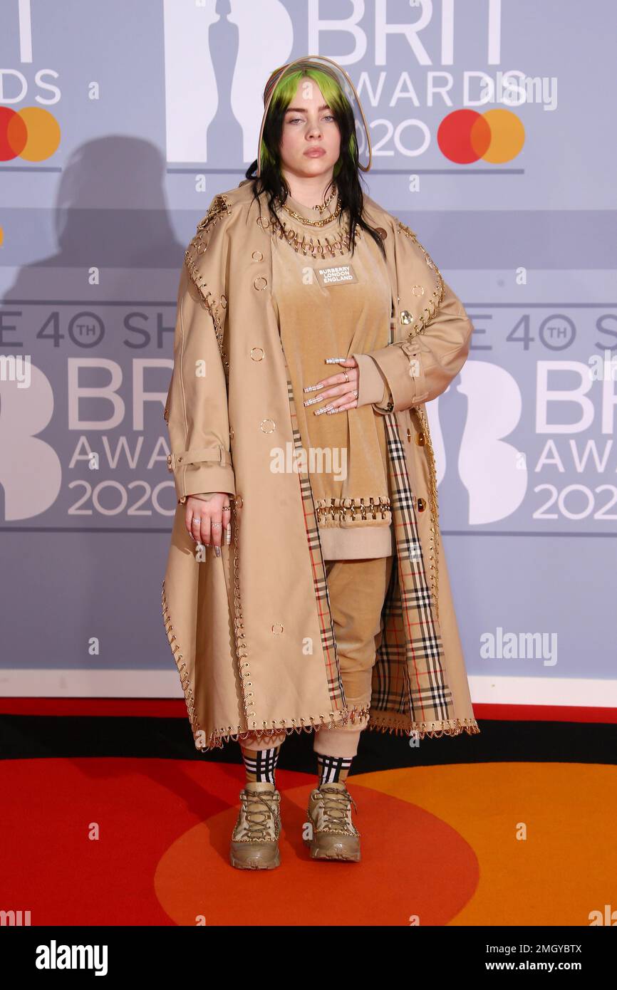 Singer Billie Eilish poses for photographers upon arrival at the Brit ...