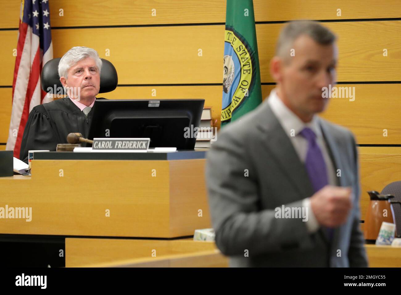 Judge Stanley Rumbaugh, left, listens as Ted Buck, right, an attorney ...