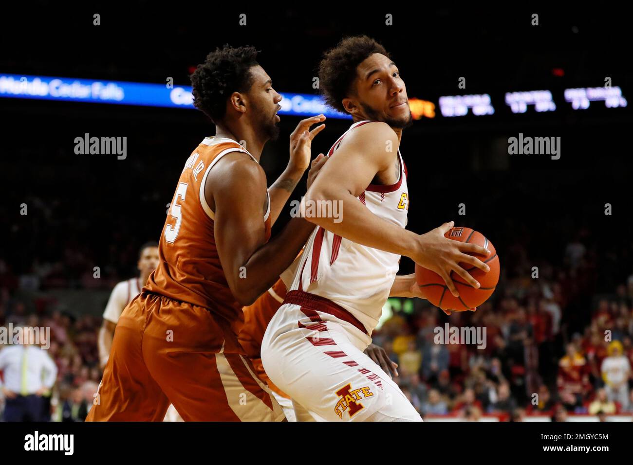 Iowa State forward George Conditt IV drives around Texas forward Royce ...