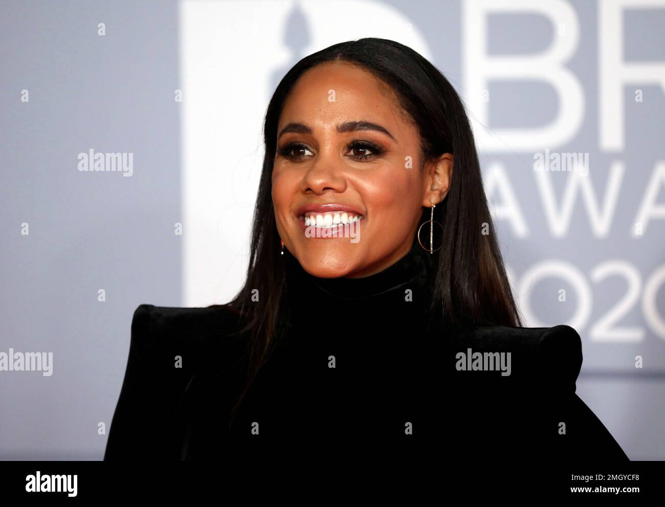 Footballer Alex Scott poses for photographers upon arrival at Brit ...