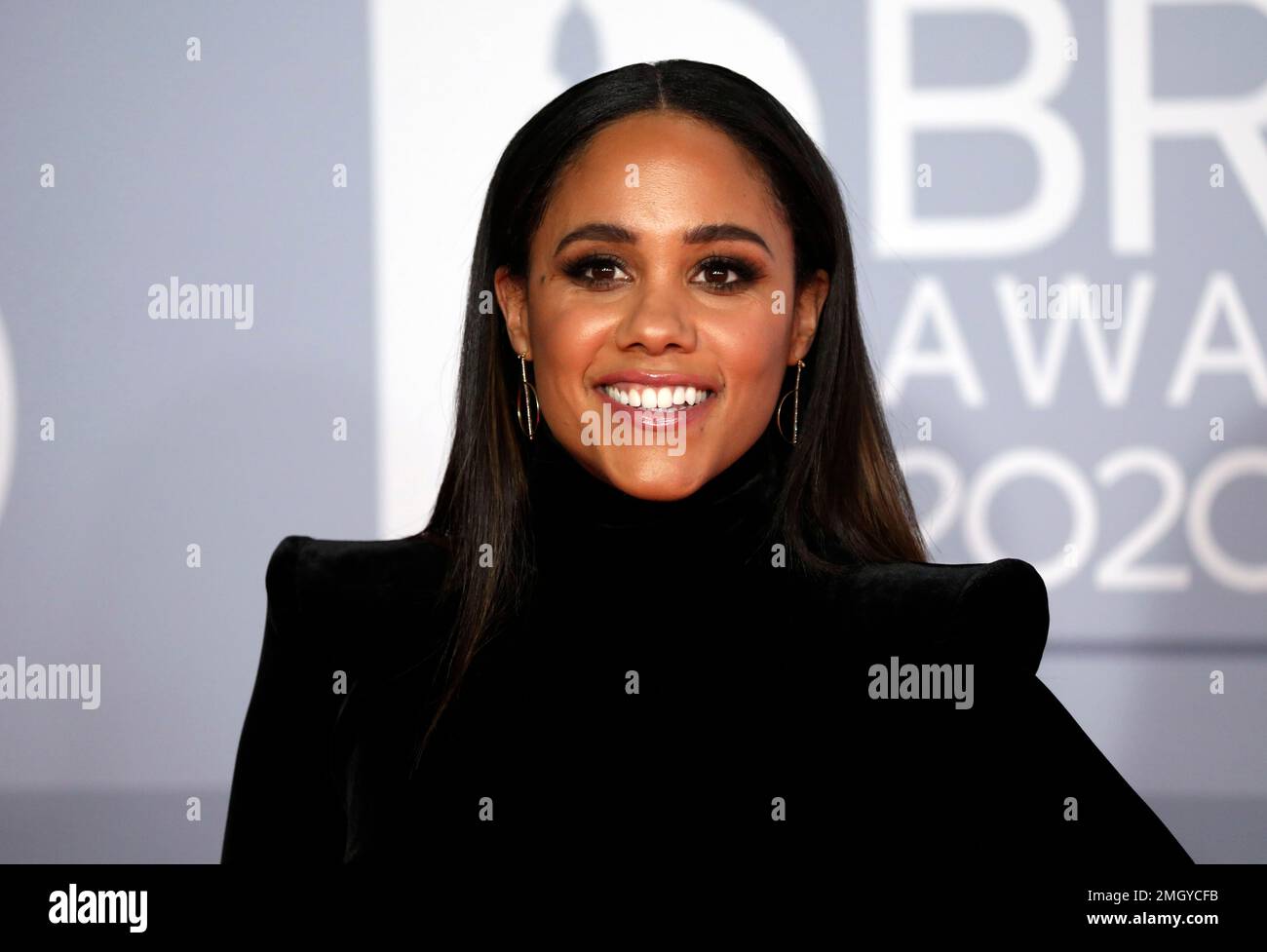 Footballer Alex Scott poses for photographers upon arrival at Brit ...