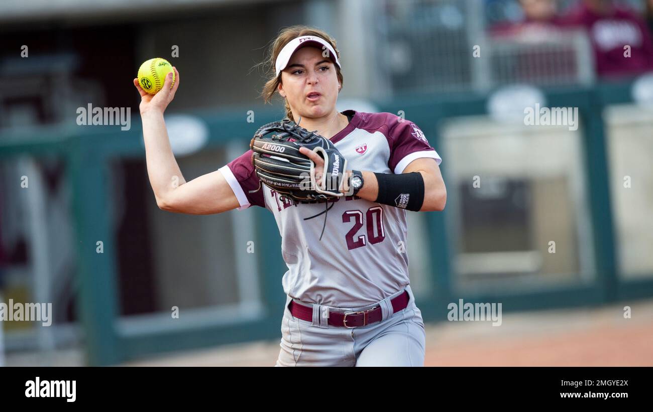 Texas A&M's Ashlynn Walls (20) throws to first for an out against Lamar ...