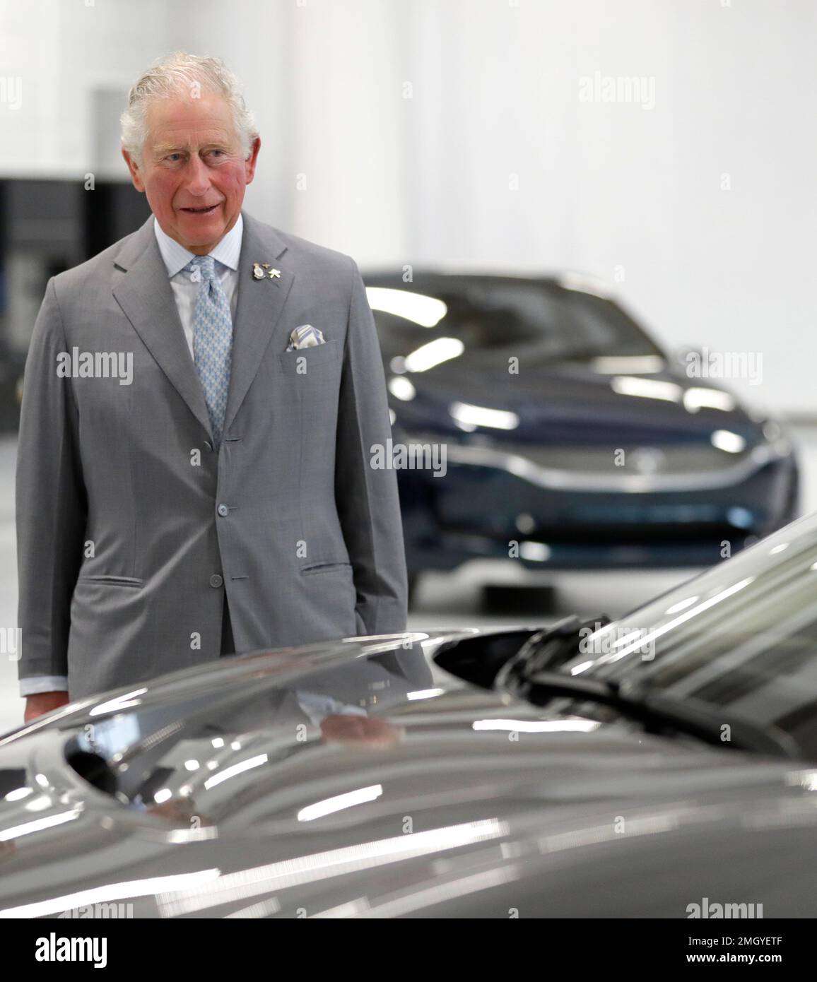 Britain's Prince Charles looks at future vehicles as he is shown the ...