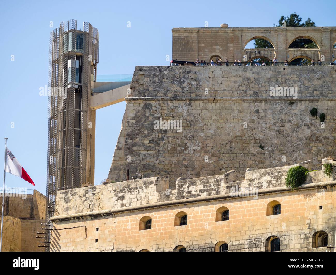 Lift to the Upper Barrakka Gardens and people admiring the view ...