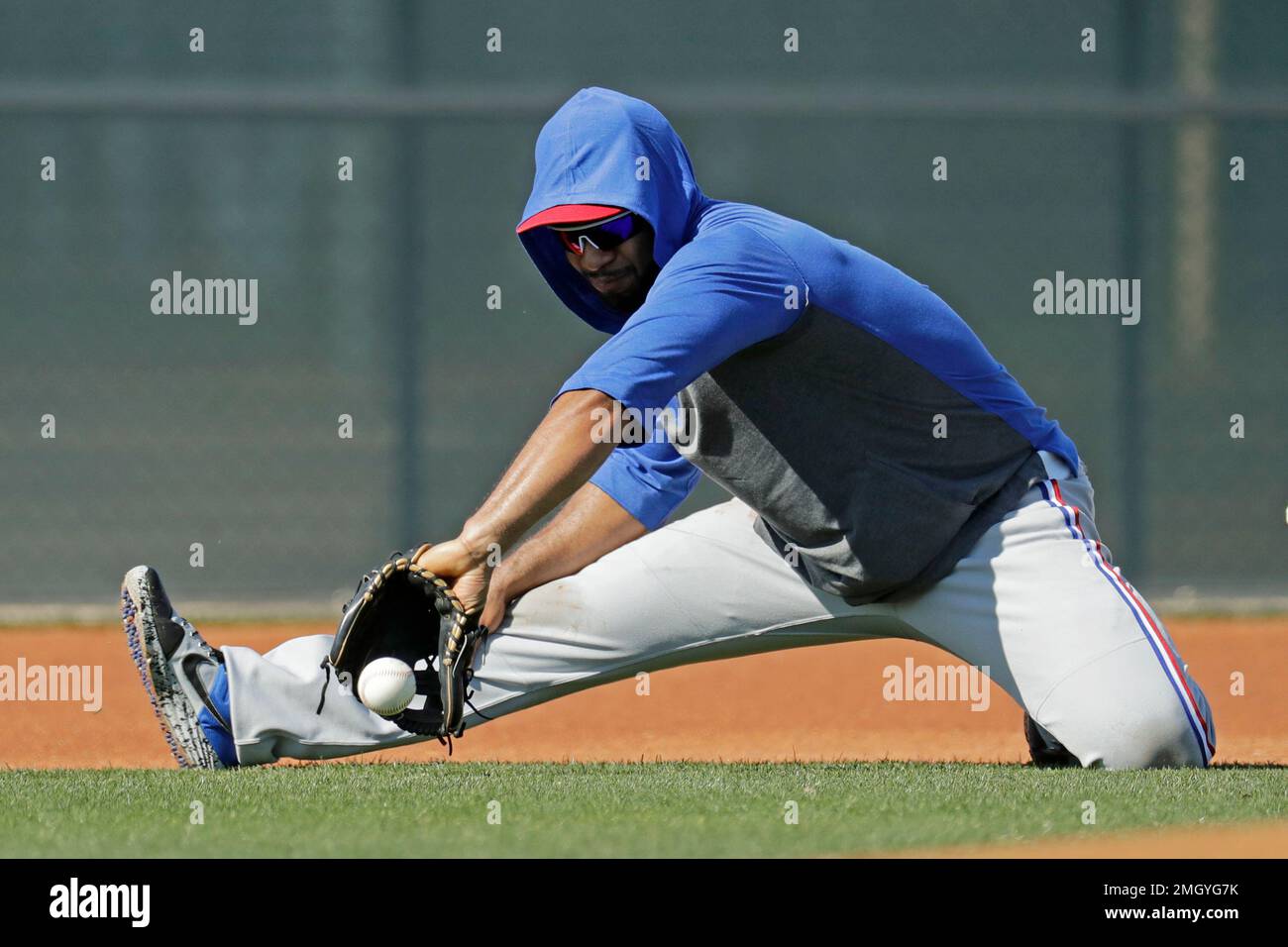 Texas Rangers' Elvis Andrus fields a ball during spring training ...
