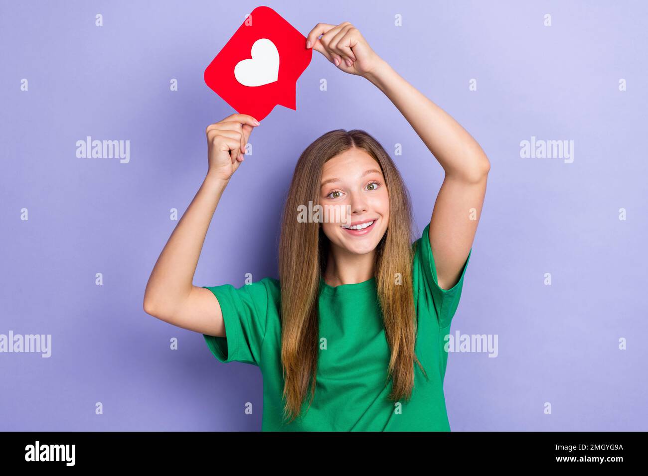 Photo of adorable cute lady wear green bright clothes raise hand red ...