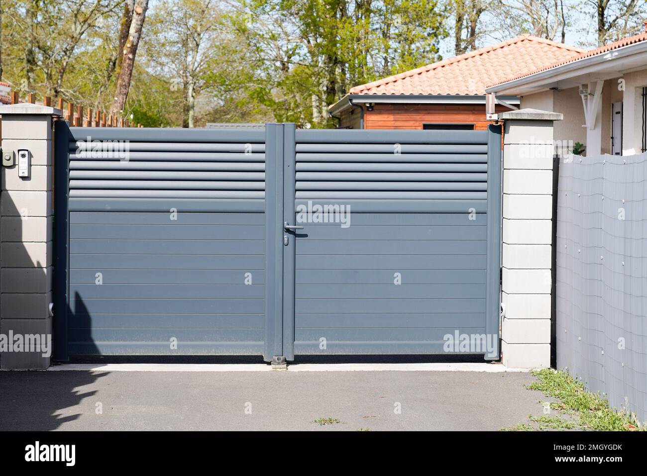 metal gate grey home fence portal on suburb street house Stock Photo ...