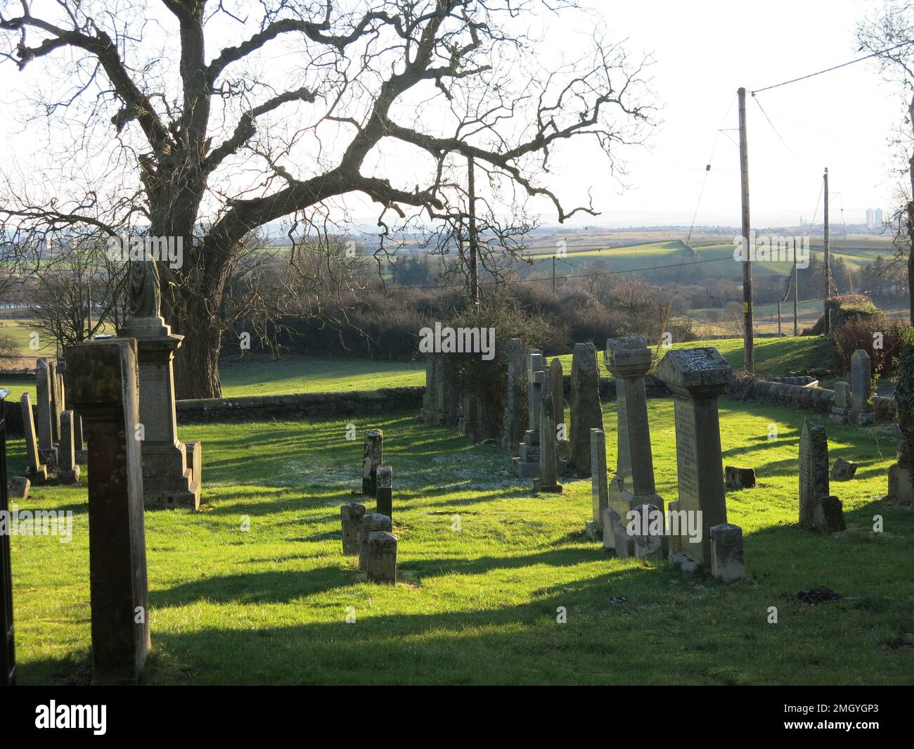 Scottish country churchyard: gravestones in the winter sunlight in the ...